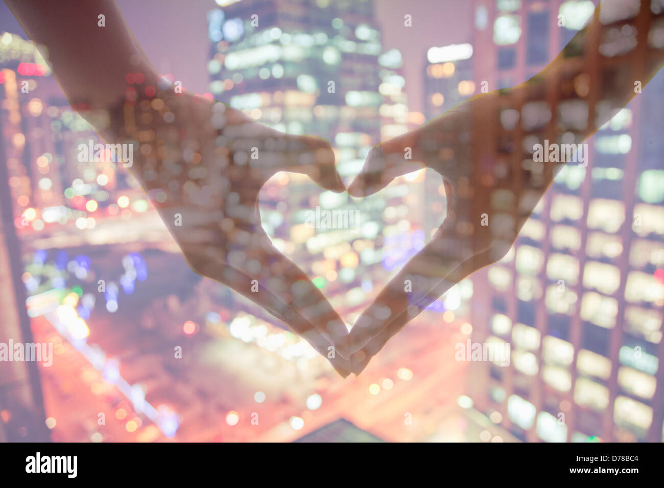 Making Heart Sign with Hands, Night View Stock Photo - Alamy