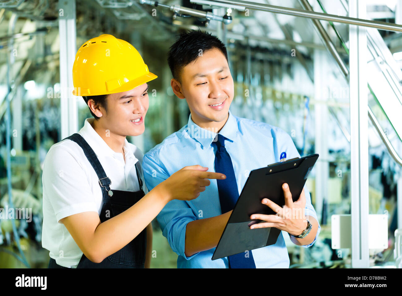 Worker or production manager and owner, ceo or controller, look on a ...