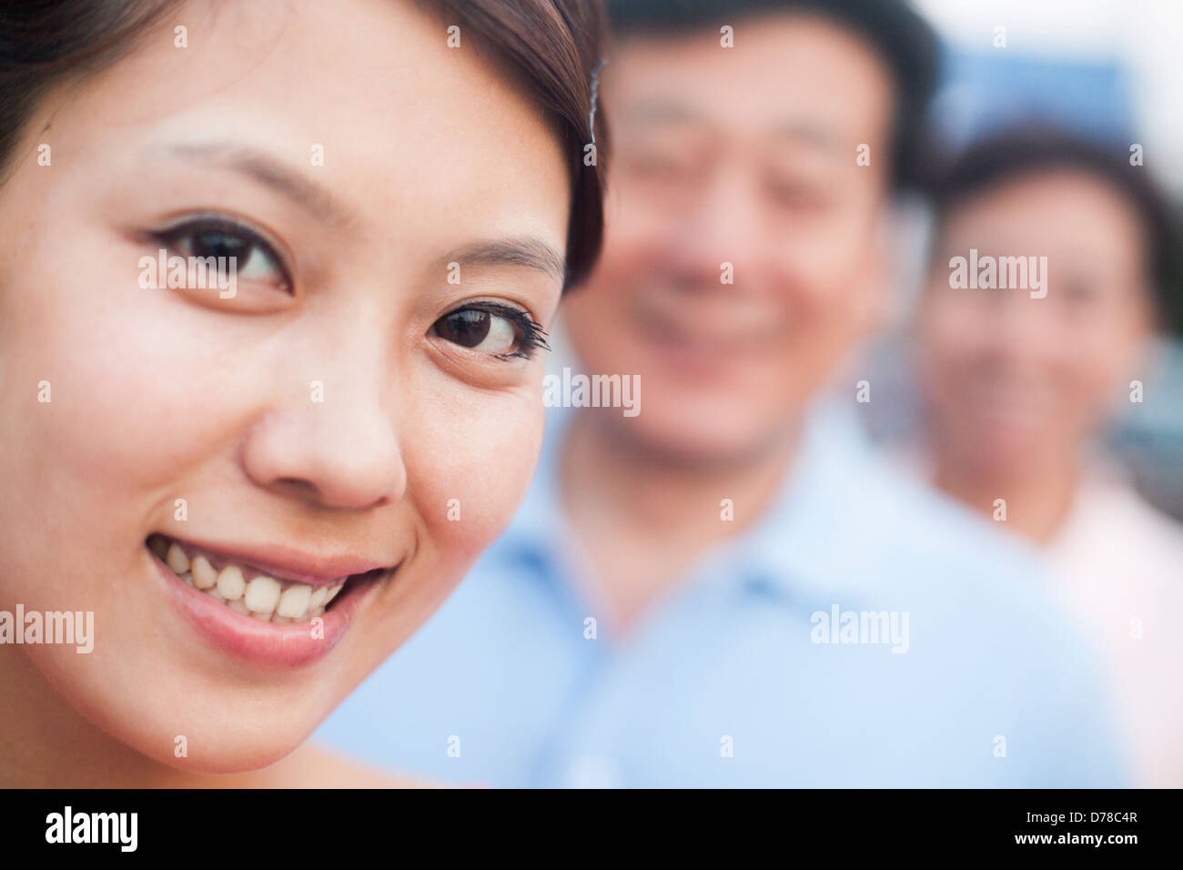 Woman smiling with her parents, portrait Stock Photo - Alamy