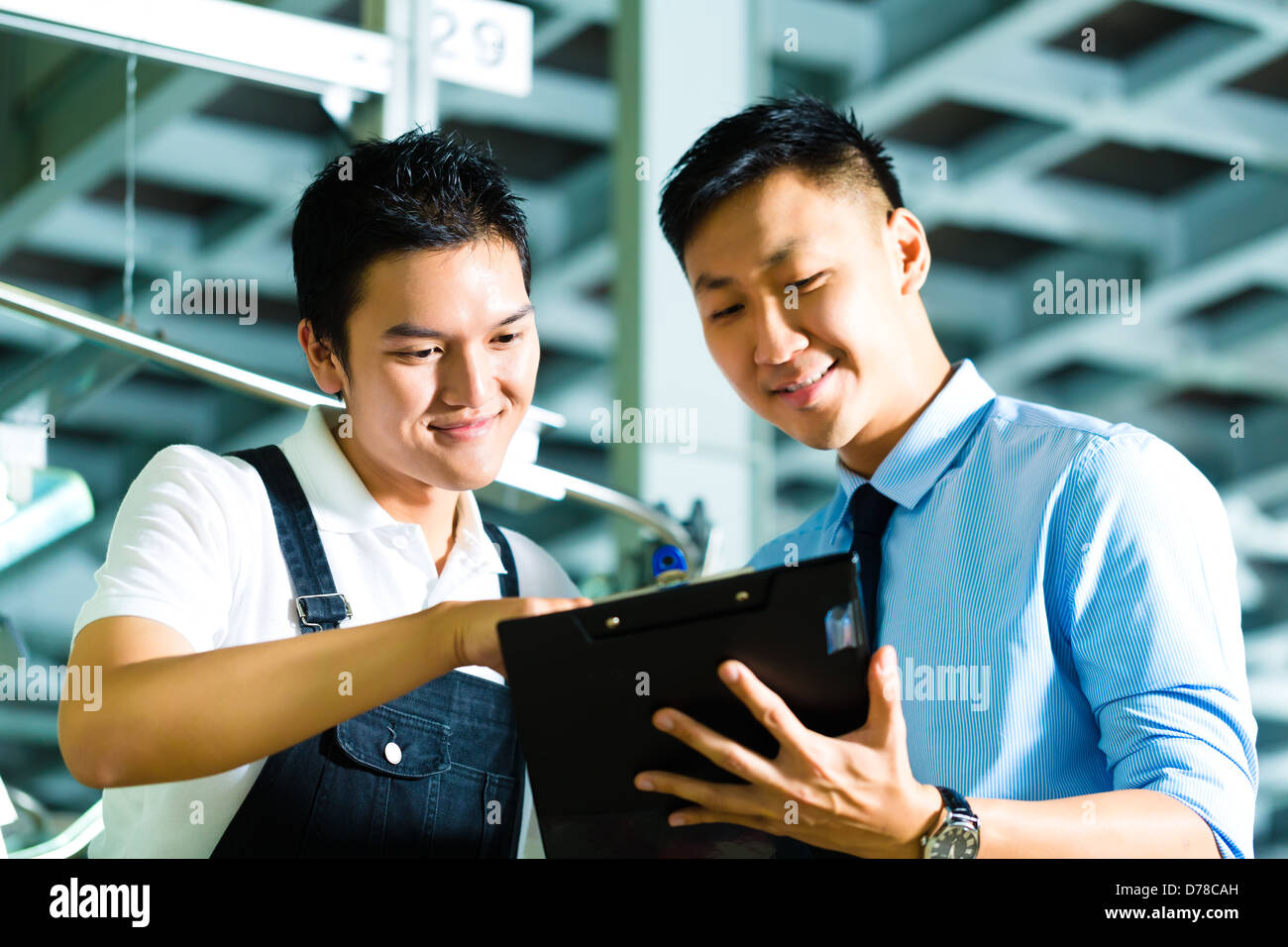 Worker or production manager and owner, ceo or controller, look on a ...