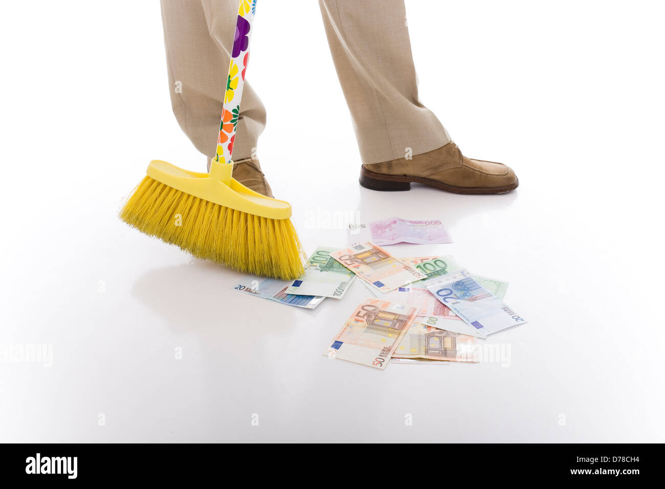 Man sweeping many euro banknotes on the floor Stock Photo - Alamy