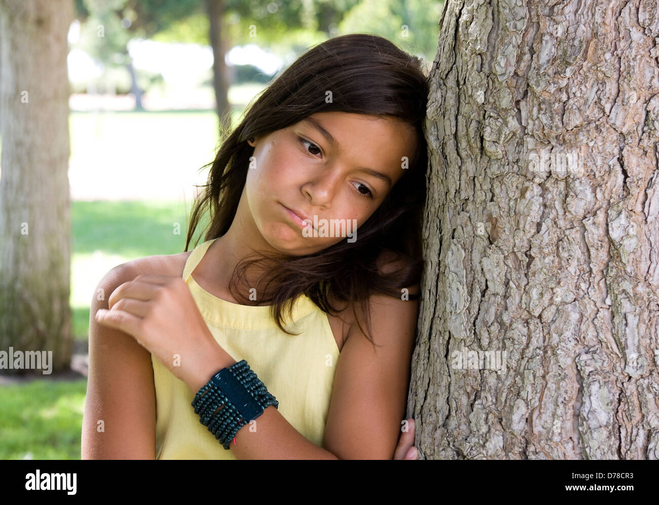 Portrait of a timid young girl on the park Stock Photo - Alamy