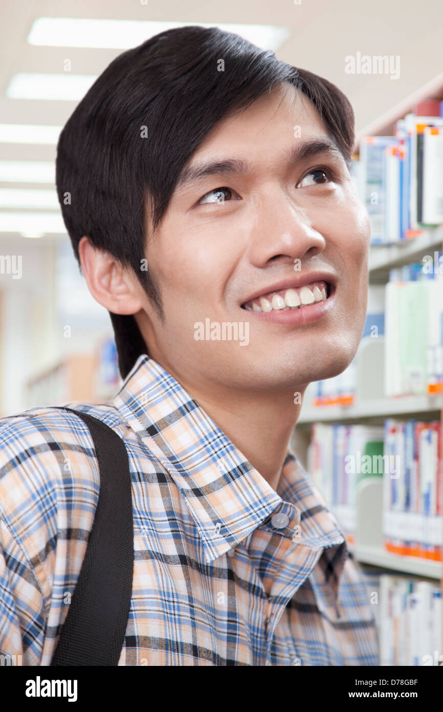 Young Man in Library Stock Photo - Alamy