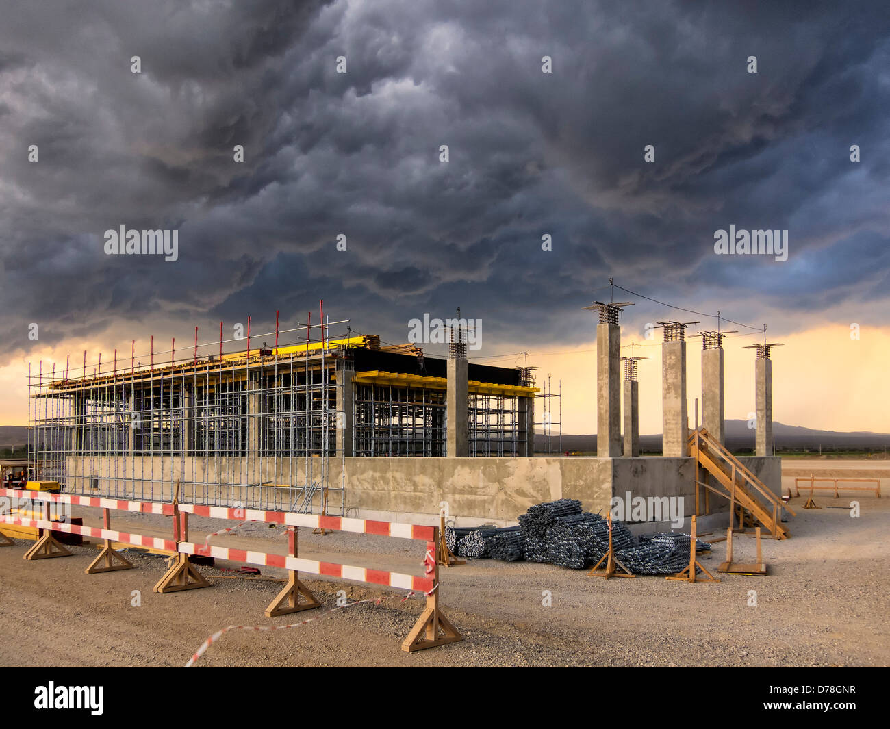 Building under construction with a stormy sky as background Stock Photo ...