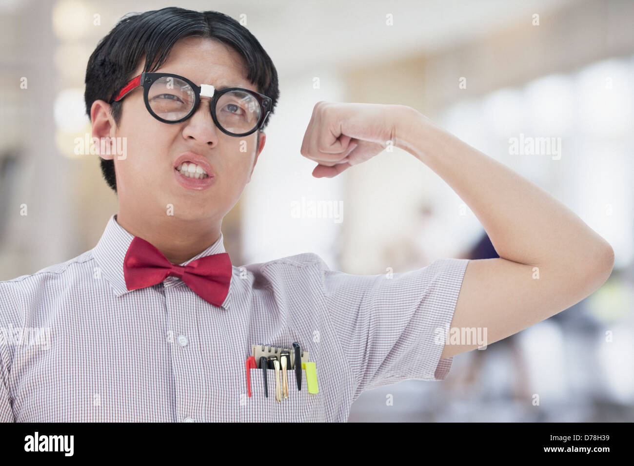 Nerdy Man Flexing His Bicep Stock Photo - Alamy