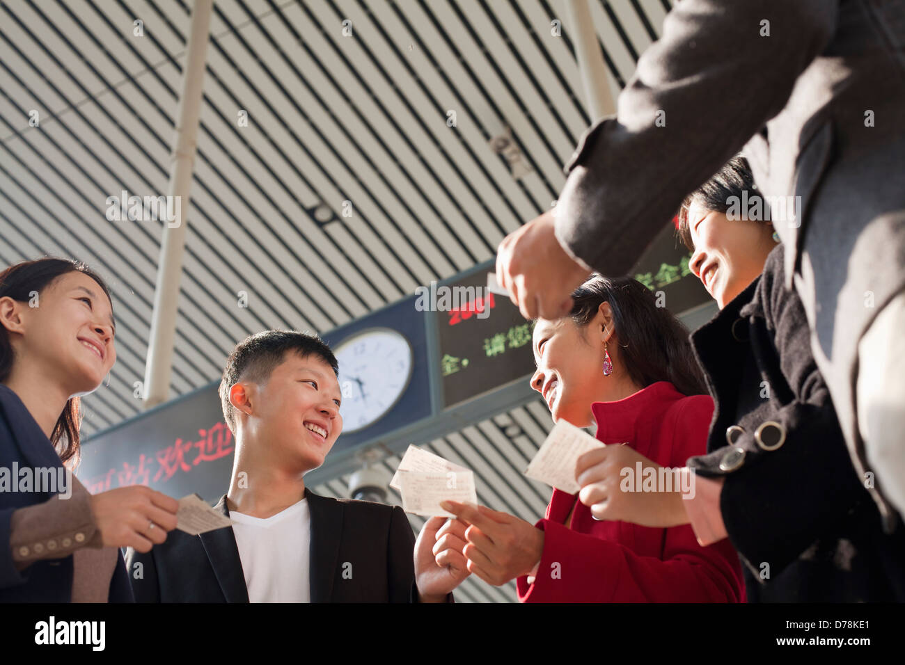 Group of people looking at tickets at the railway station Stock Photo ...