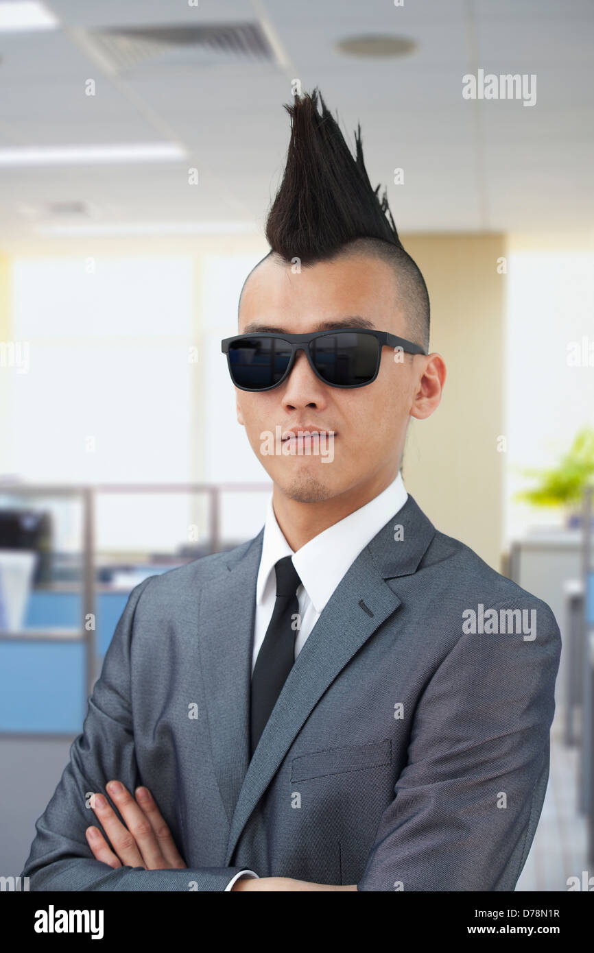 Well-dressed young man with Mohawk and sunglasses Stock Photo - Alamy