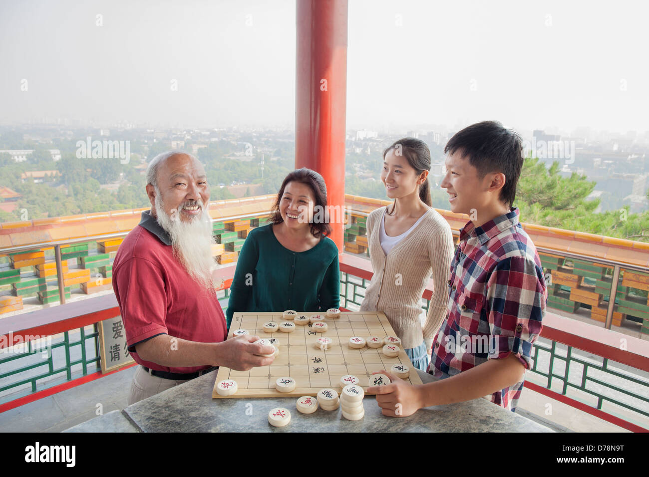 Chinese Family Playing Chinese Chess (Xiang Qi Stock Photo - Alamy