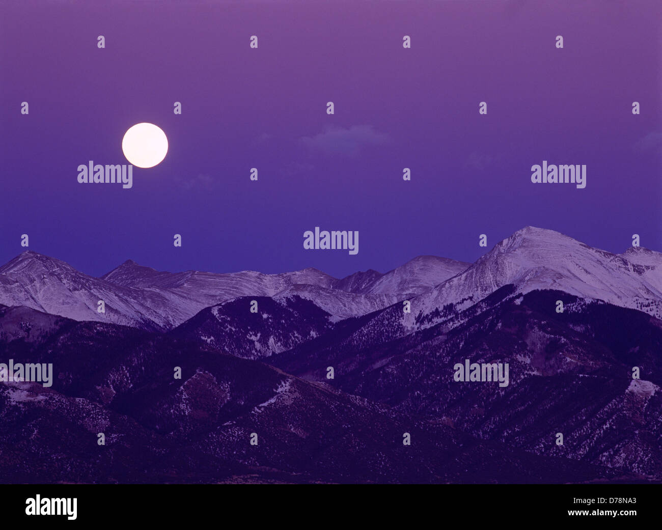 Full moon rising over Sangre de Cristo Mountains at dusk Rio Grande ...