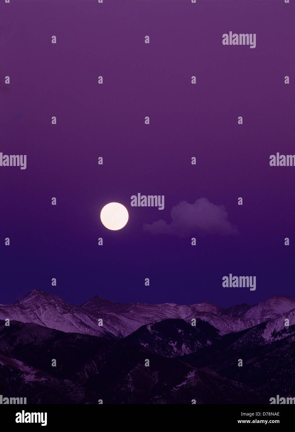 Full moon rising over Sangre de Cristo Mountains at dusk Rio Grande ...