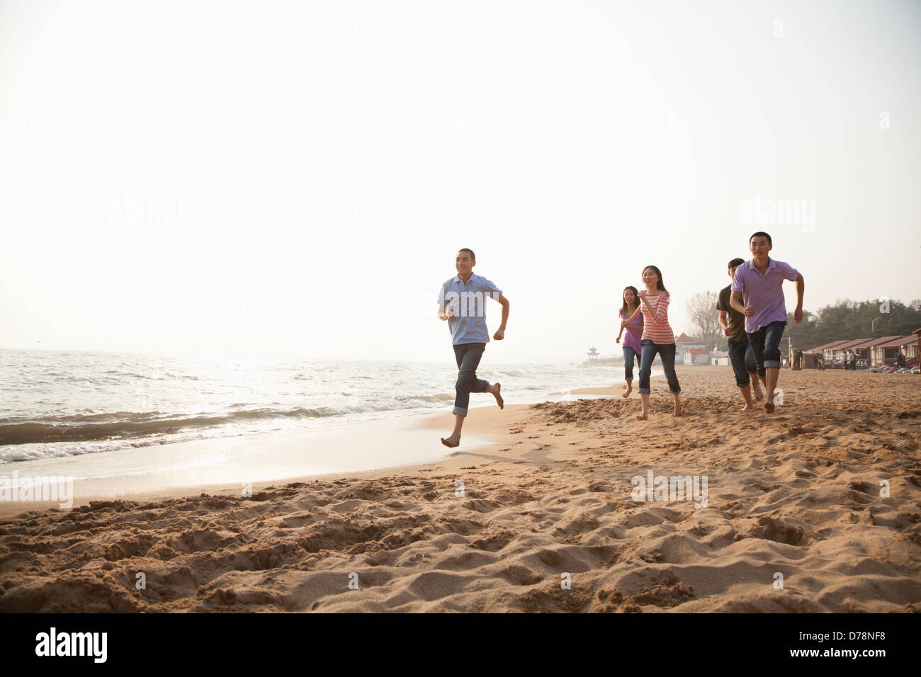 Friends Running at the Beach Stock Photo - Alamy