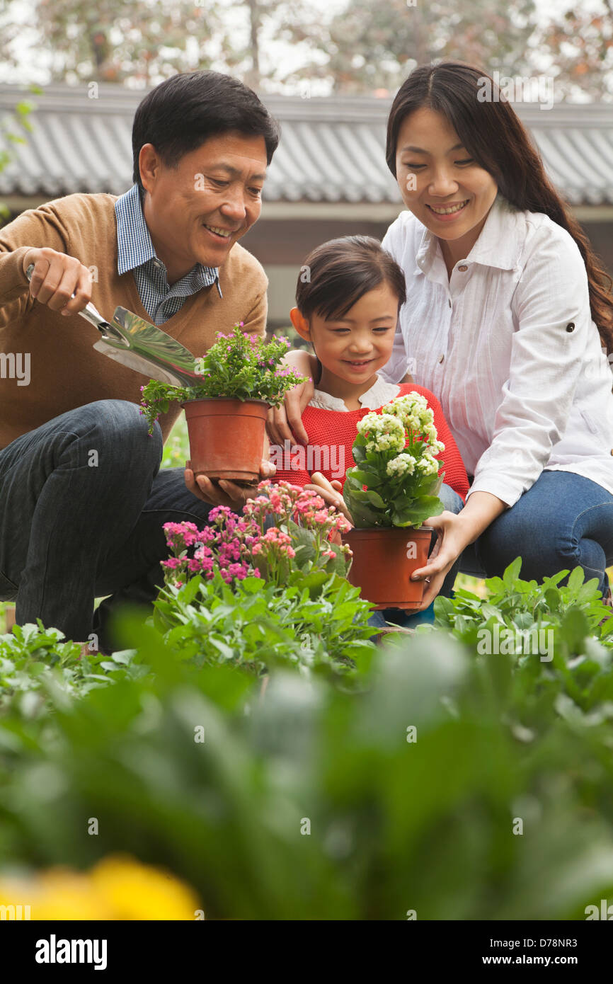 Happy family in garden Stock Photo - Alamy