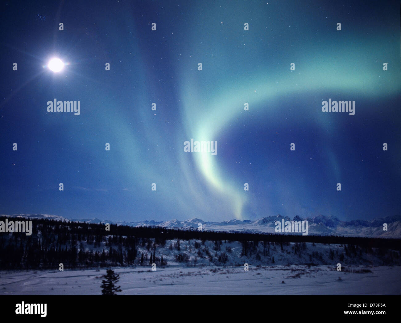 Green aurora moon above Chulitna river Alaska range geomagnetic storm ...