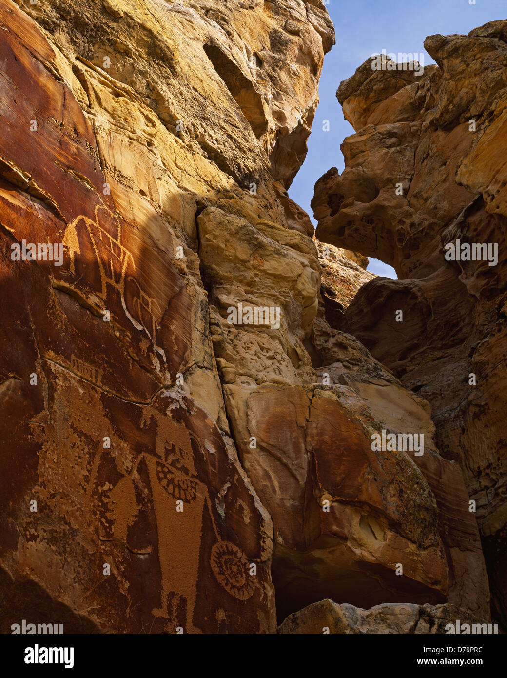 Classic Vernal Style Fremont petroglyphs carved into sandstone cliff ...