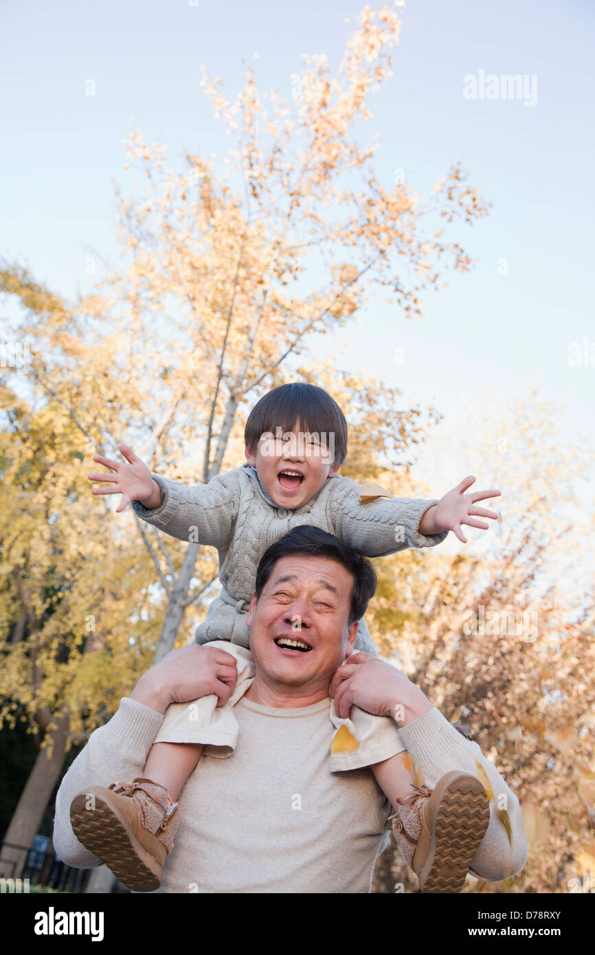 Grandfather and Grandson Playing in the Park Stock Photo - Alamy