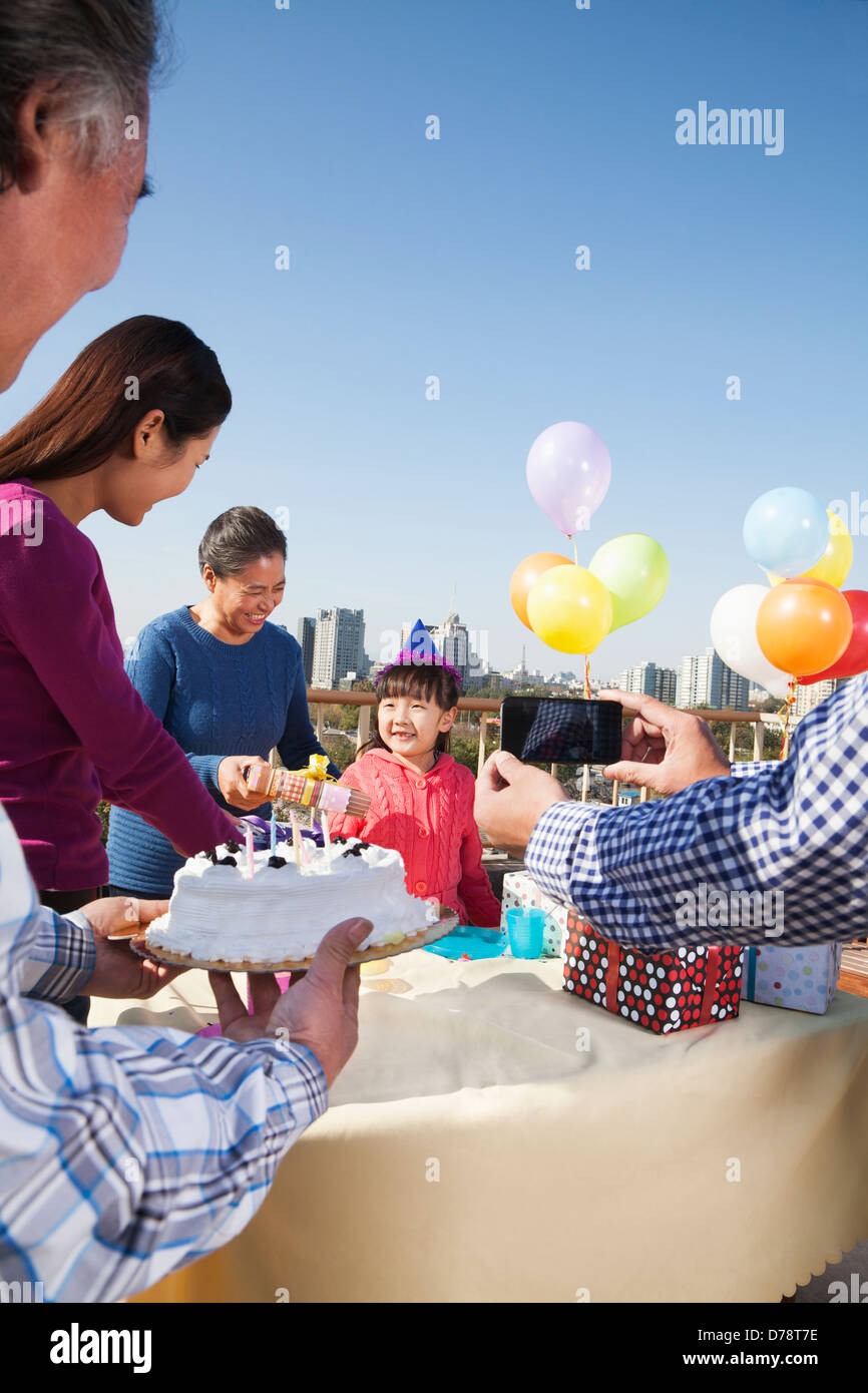 Birthday part, multi-generation family Stock Photo - Alamy