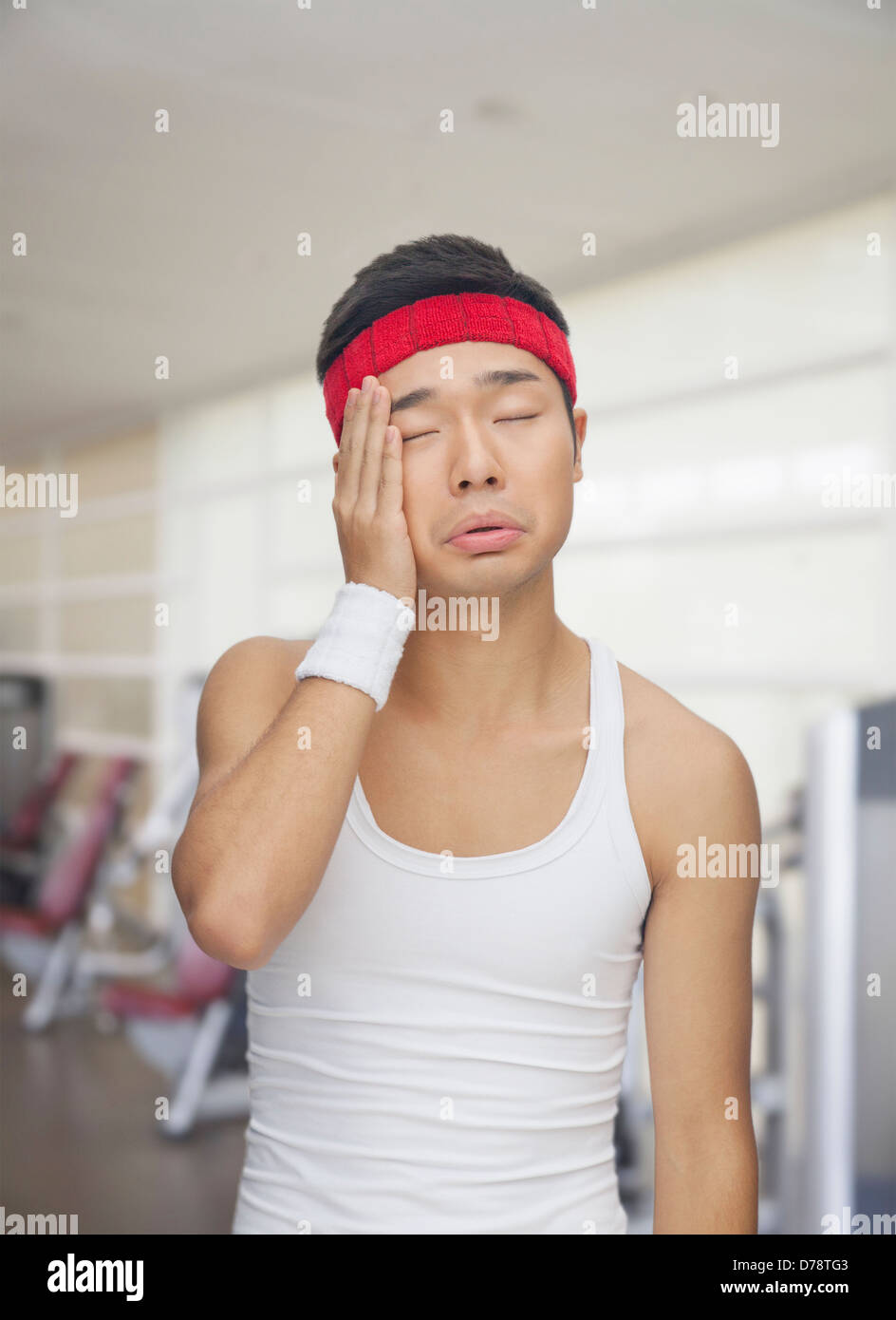 Portrait of tired young man at the gym Stock Photo - Alamy