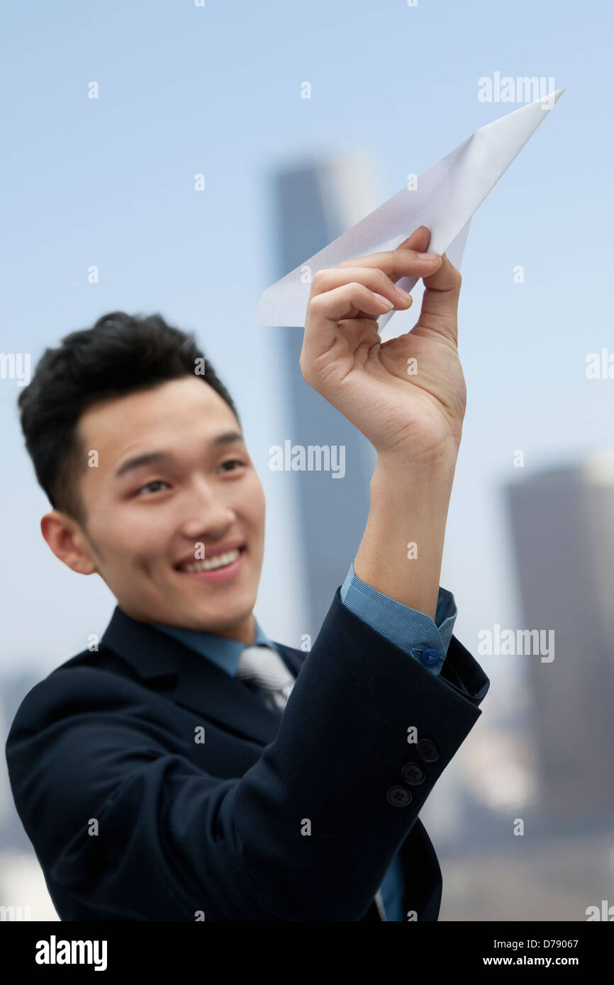 Businessman flying paper airplane hi-res stock photography and images ...