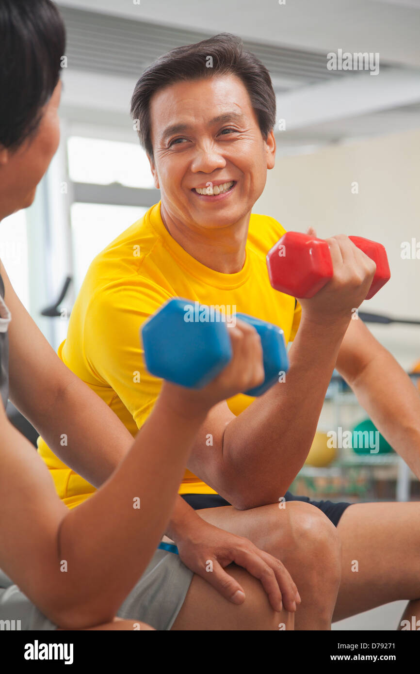 Two men lifting weights in gym hi-res stock photography and images - Alamy