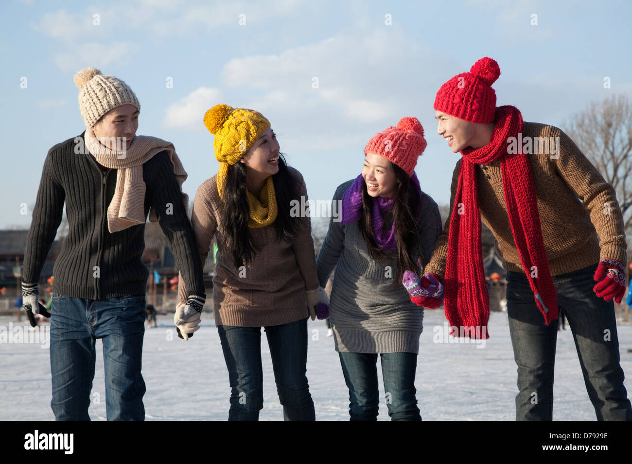Friends on ice rink Stock Photo - Alamy