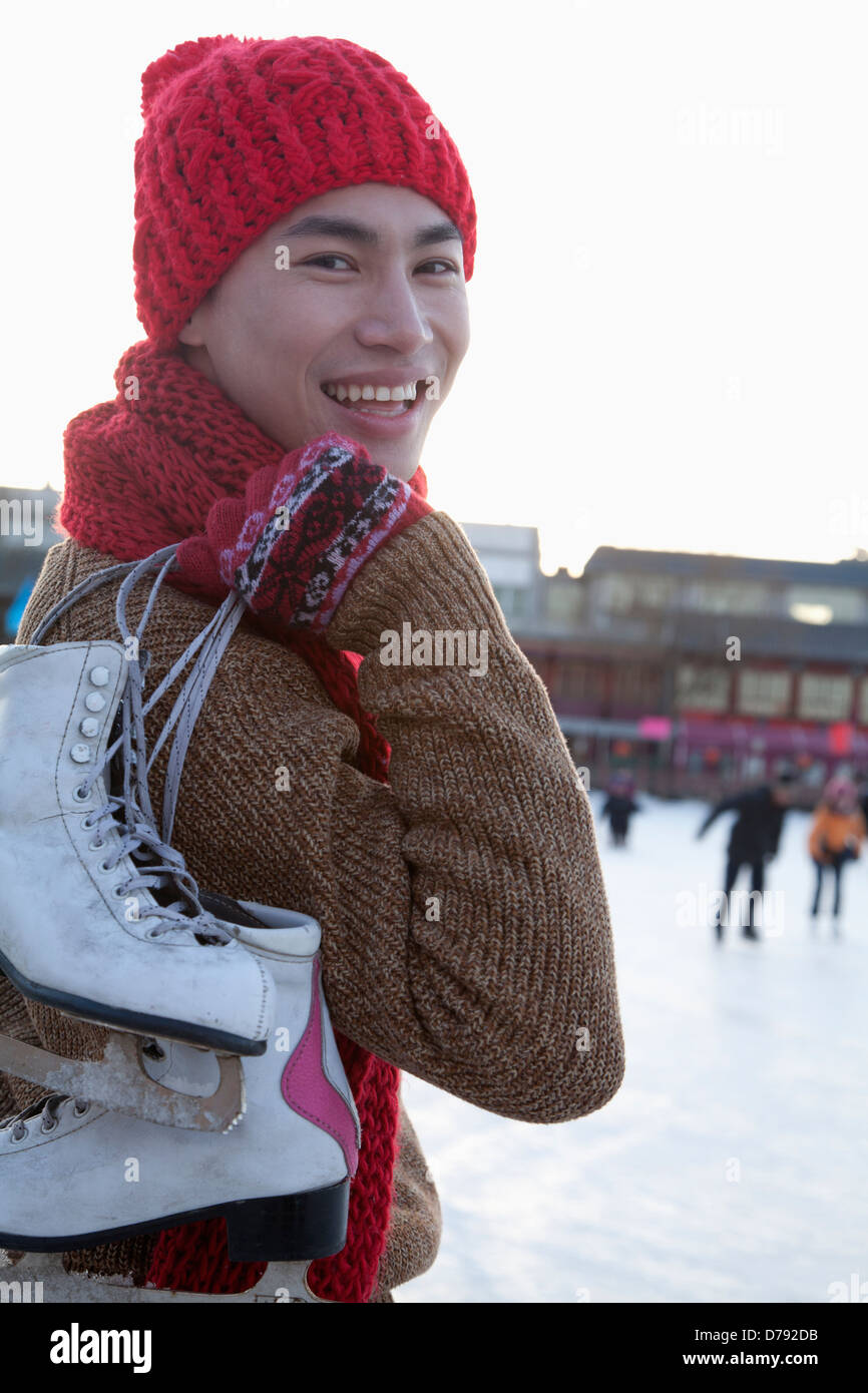 Young man on ice rink Stock Photo - Alamy
