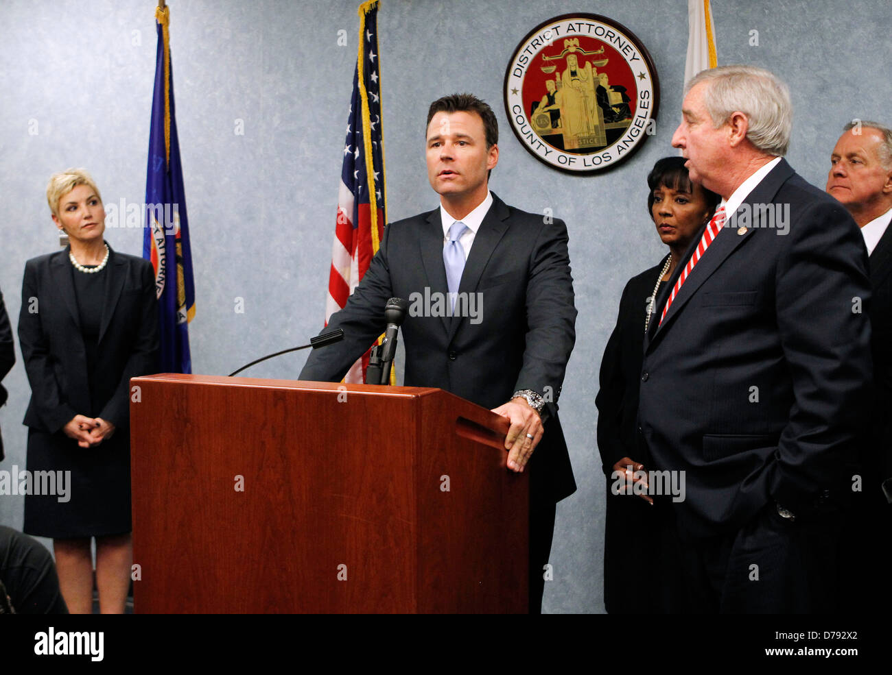 Deputy District Attorney David Walgren, center, makes a statement as ...