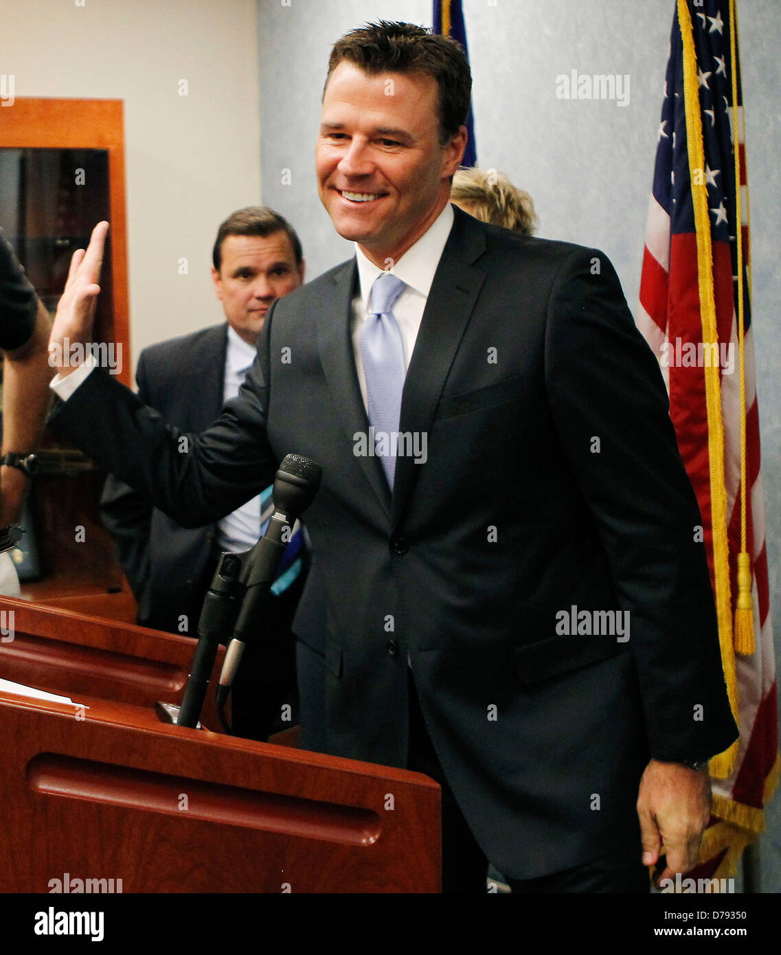 Deputy District Attorney David Walgren waves as he leaves a press ...