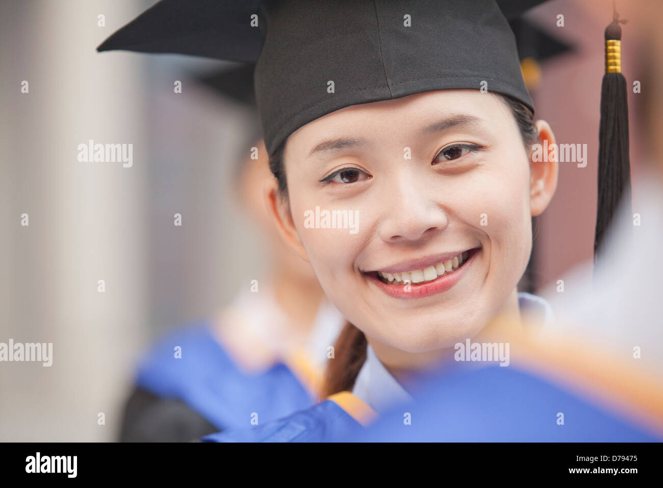 Close Up of Female Graduate Student Standing in a Row of Graduates ...