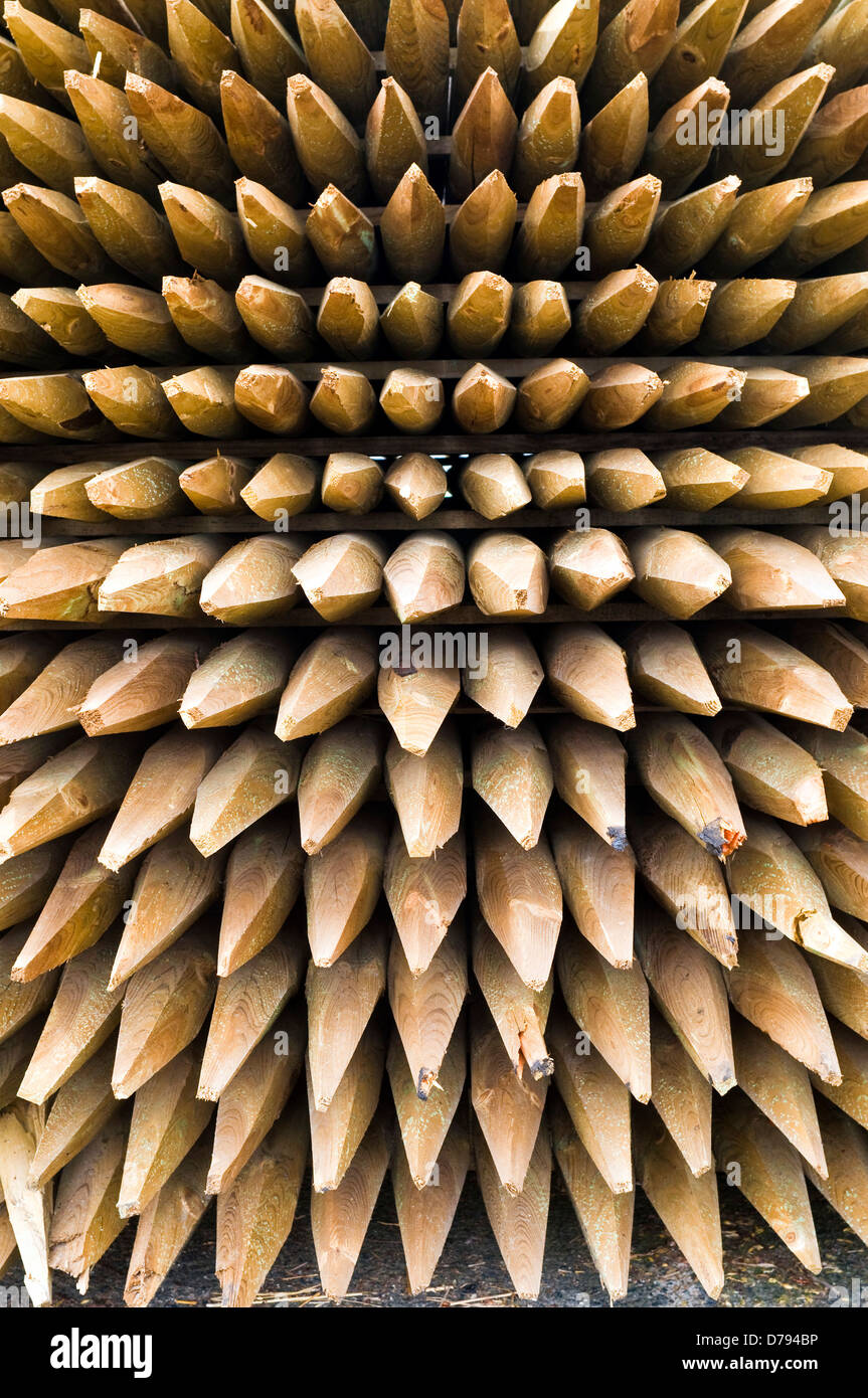 Stack of pointed poles at garden center - France Stock Photo - Alamy