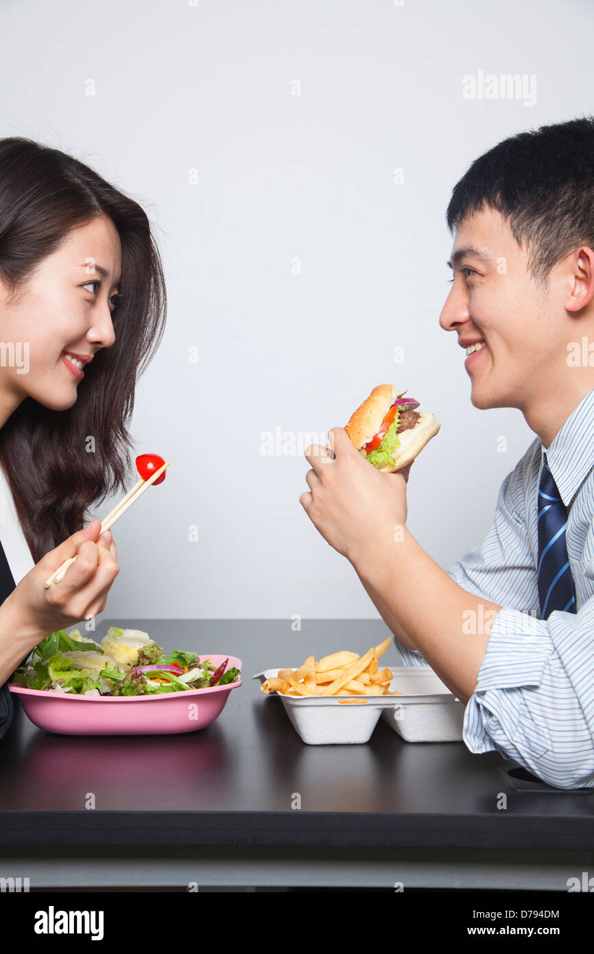 Two people eating hi-res stock photography and images - Alamy