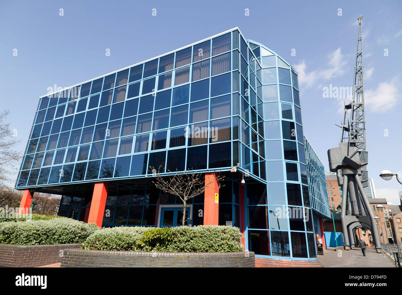 A Modern Office building alongside old dock cranes at Millwall Inner ...