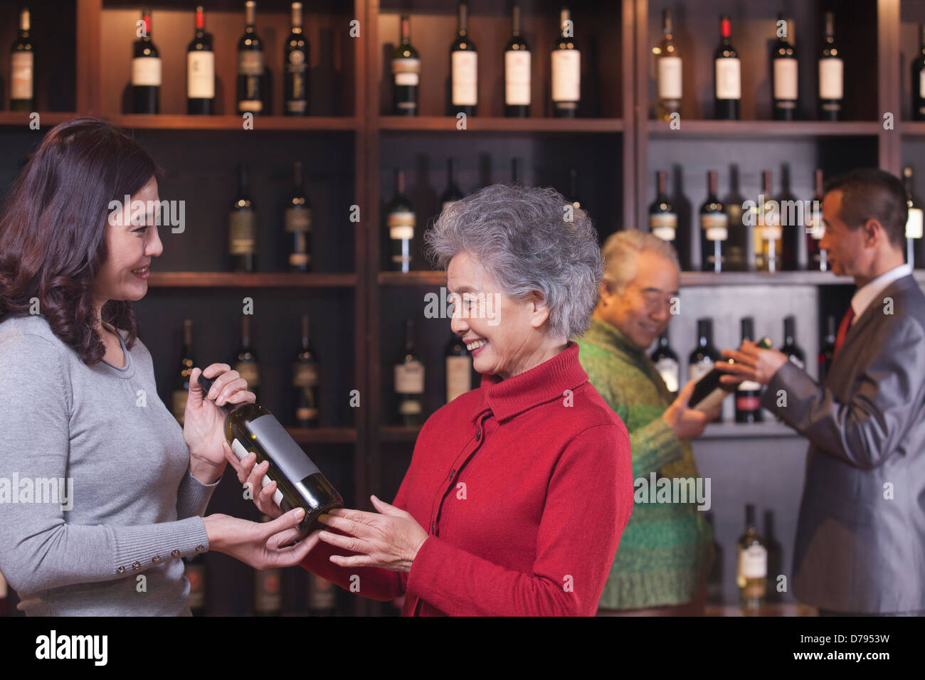 Two men holding up bottles hi-res stock photography and images - Alamy
