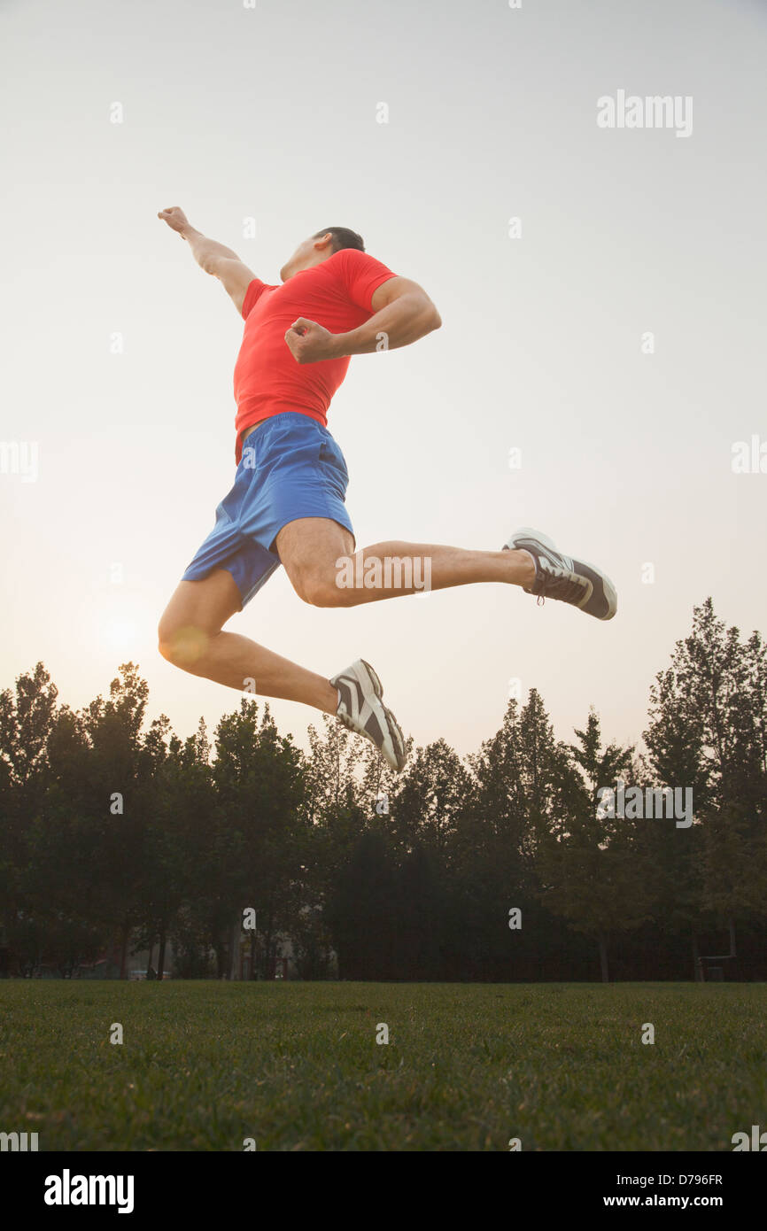 Muscular Man Jumping Stock Photo - Alamy