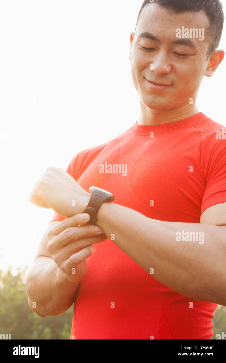 Muscular Man Checking His Watch Stock Photo - Alamy