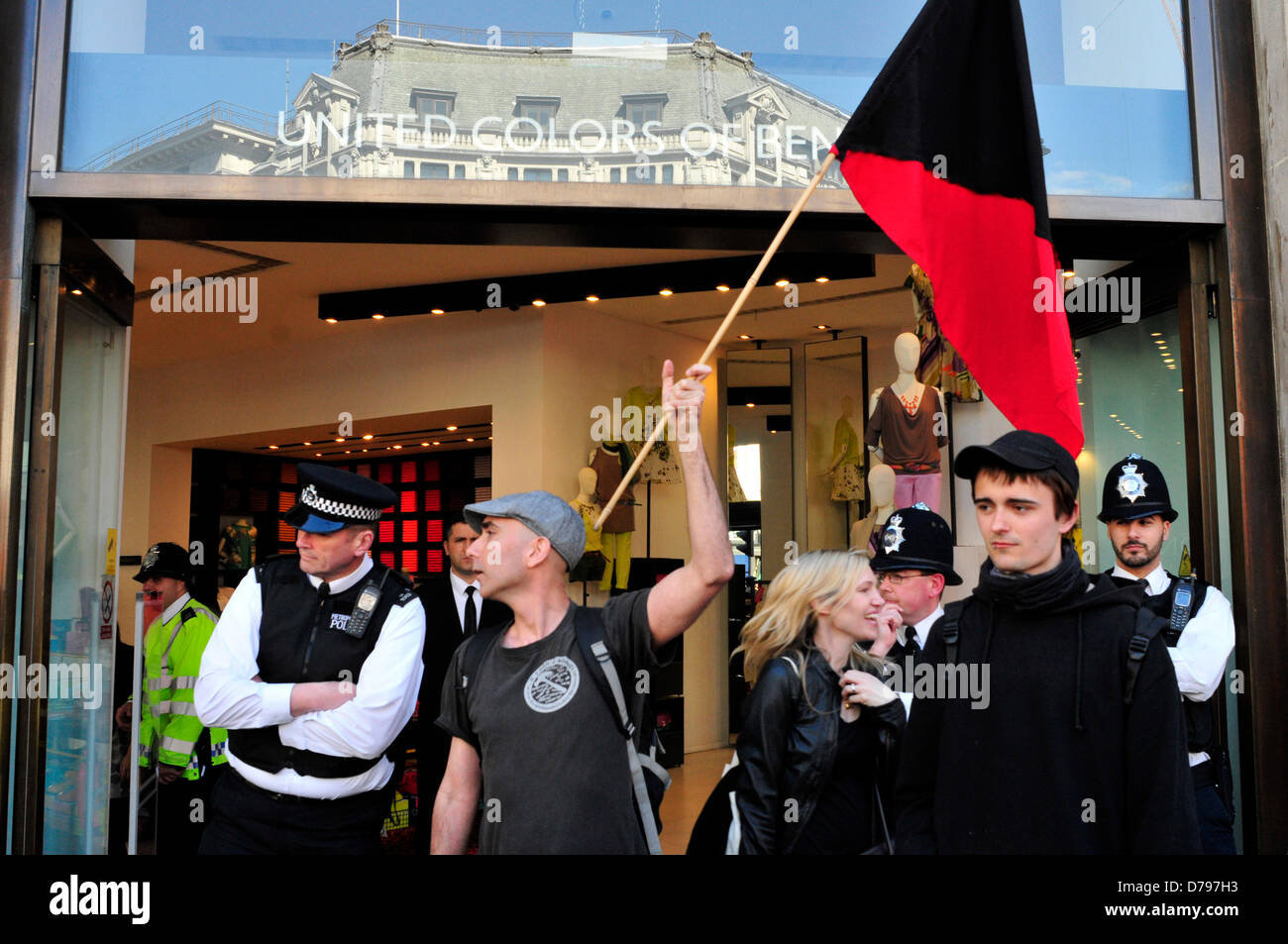 Protesters holds a flag outside United Colors of Benetton shop in ...