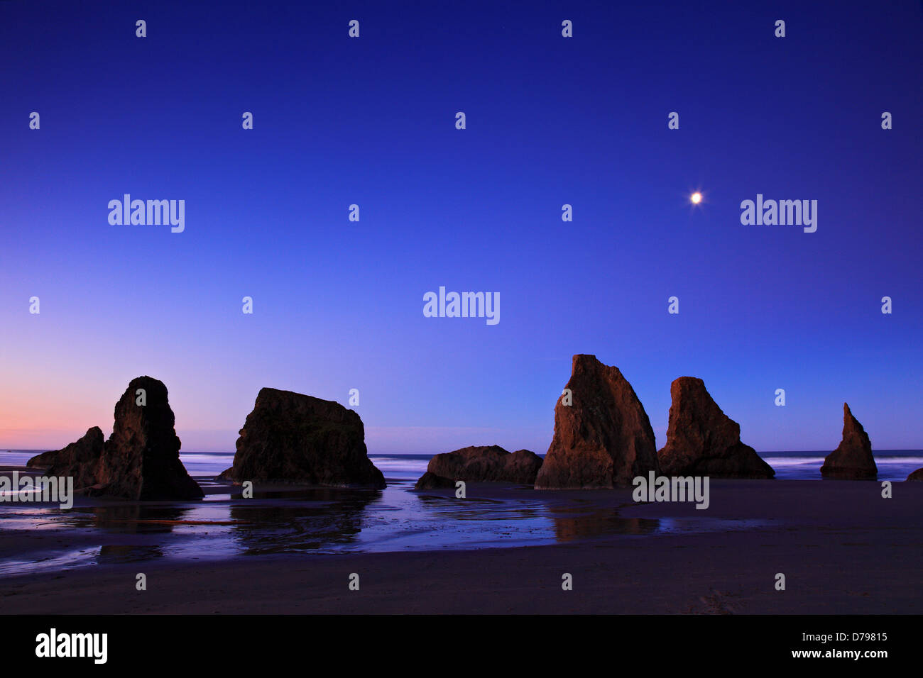 Sunrise Moon Over Sea Stacks on Face Rock Beach Stock Photo - Alamy