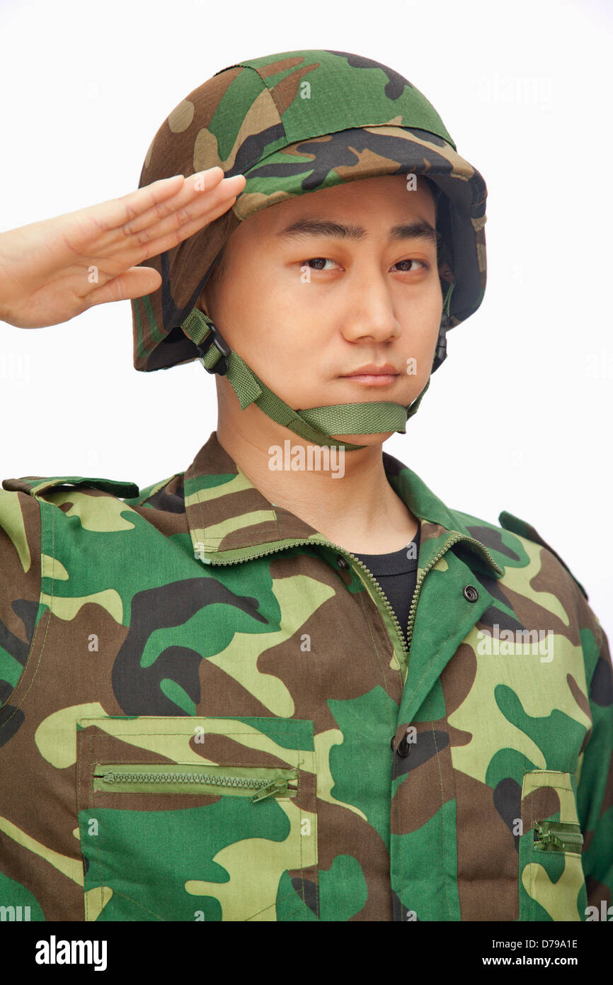 Portrait of man in military uniform saluting Stock Photo - Alamy
