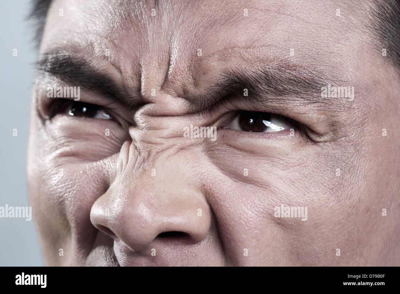 Extreme Close up on angry mans face Stock Photo - Alamy