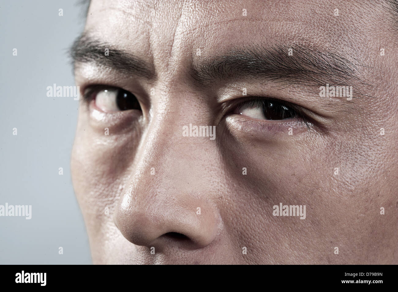 Extreme Close up on angry mans face Stock Photo - Alamy