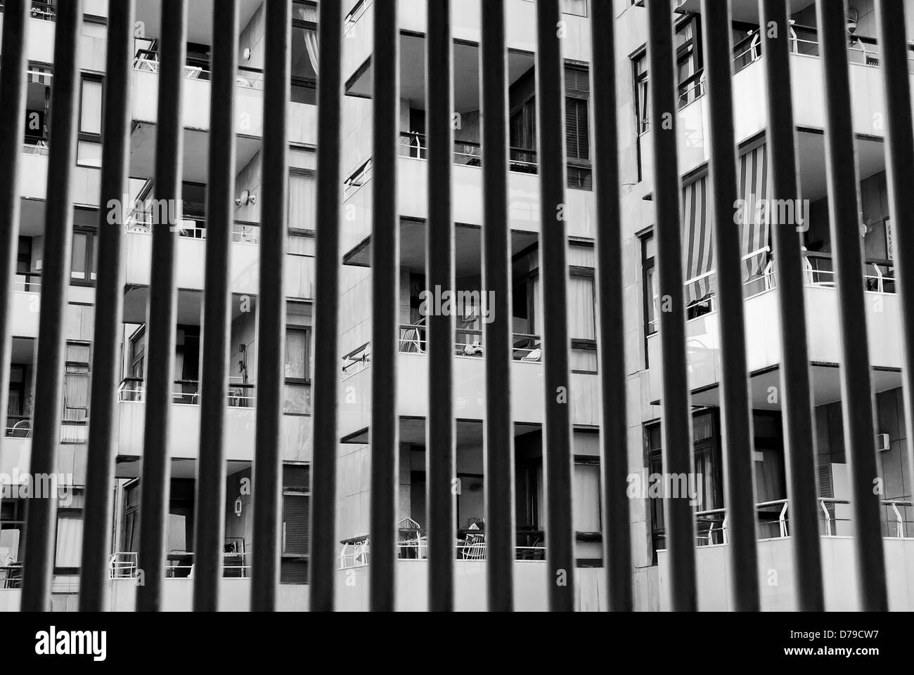Apartment building behind bars Stock Photo - Alamy