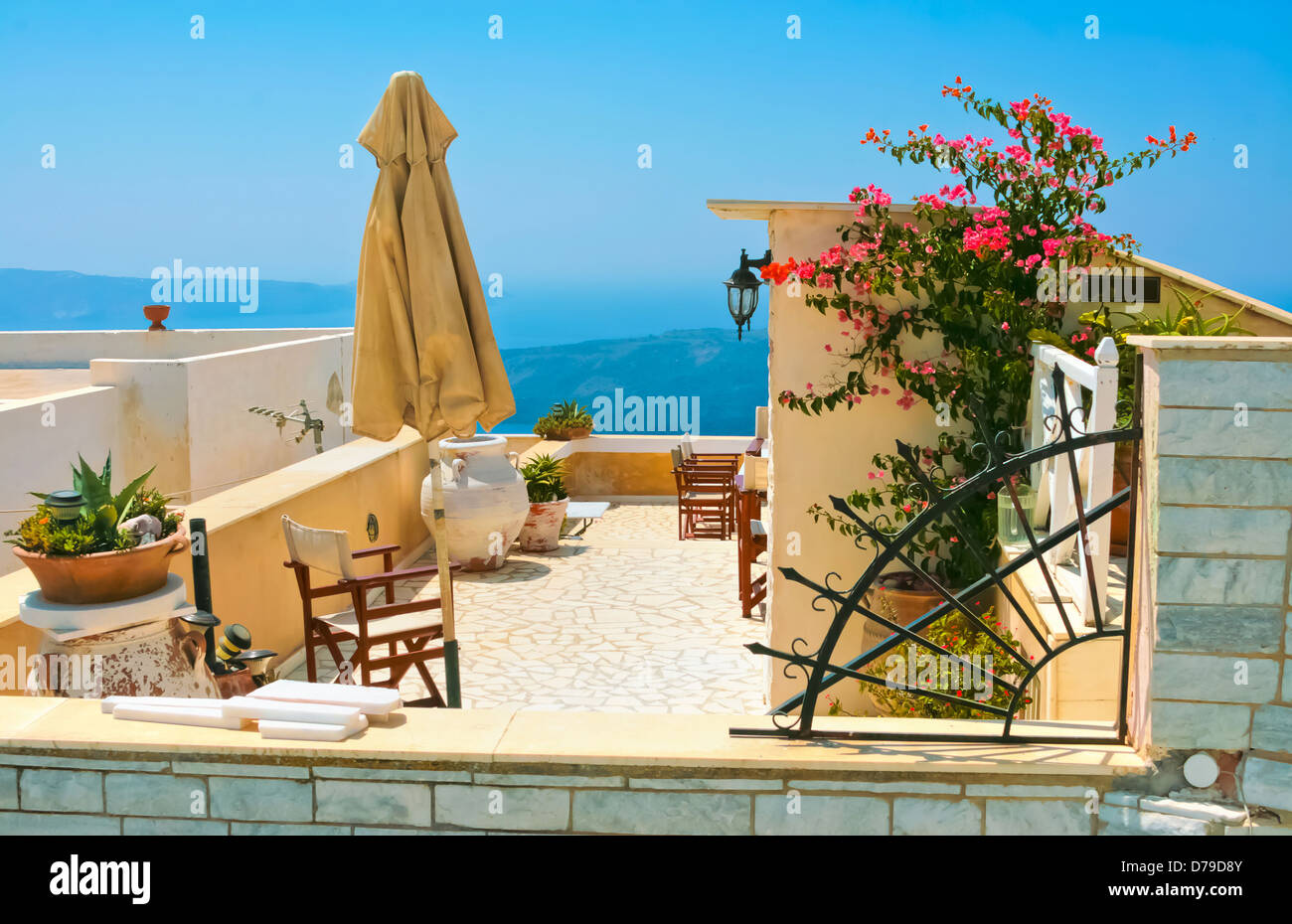 Magic terrace in Santorini, Greece with beautiful chairs, vase and ...