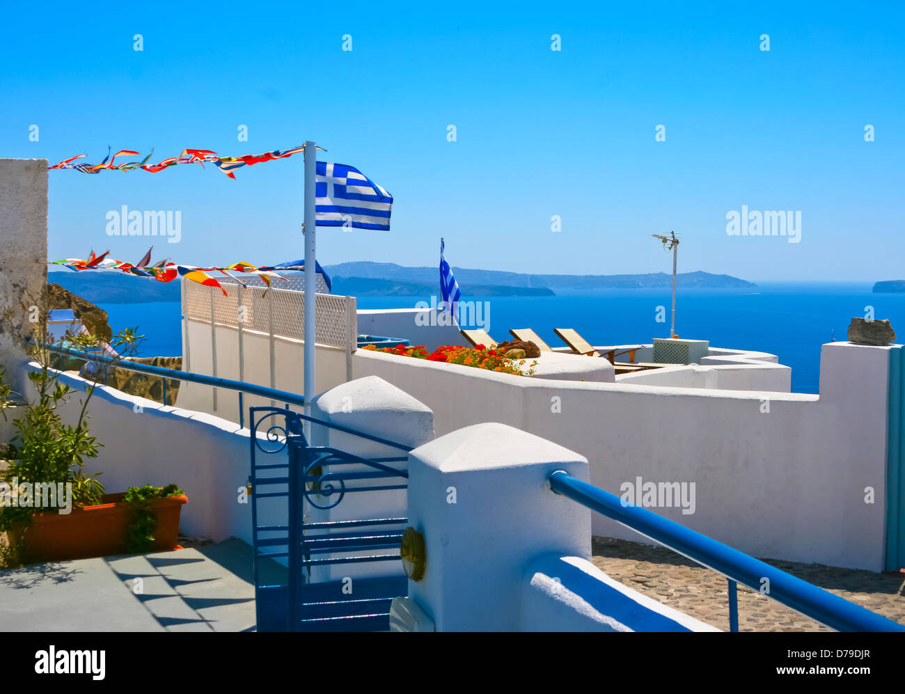Beautiful white terrace at resort on island of Santorini in Oia, Greece ...