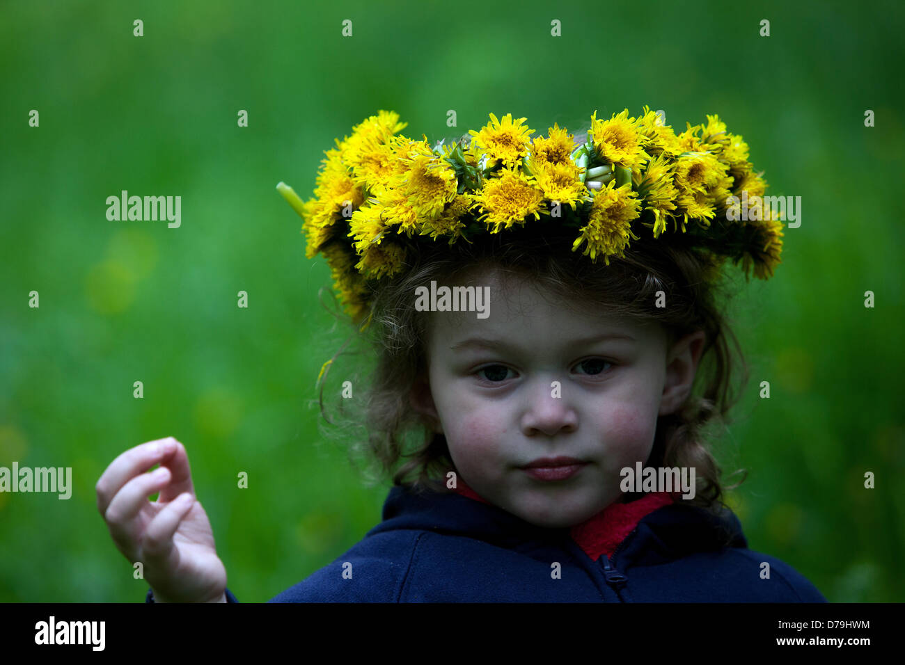 Little girl angel with a wreath of dandelions Stock Photo - Alamy