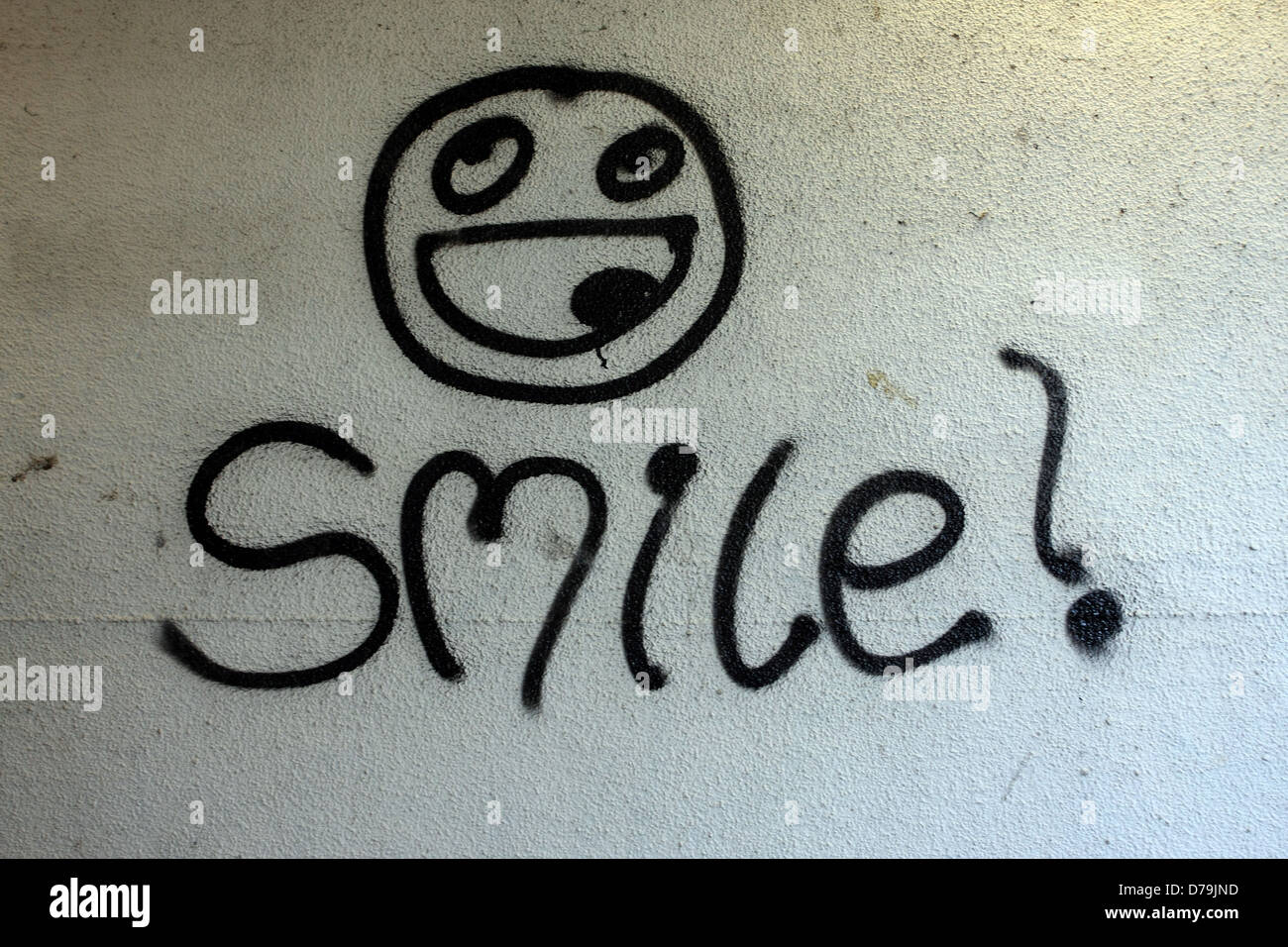 smile graffiti face painted on the walls of a pedestrian tunnel in ...