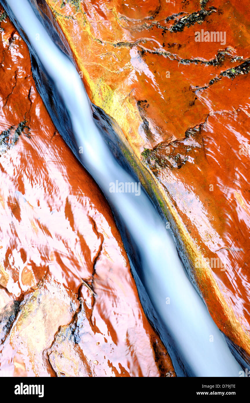 River water cuts through flows funnels funneled through a crack in the ...