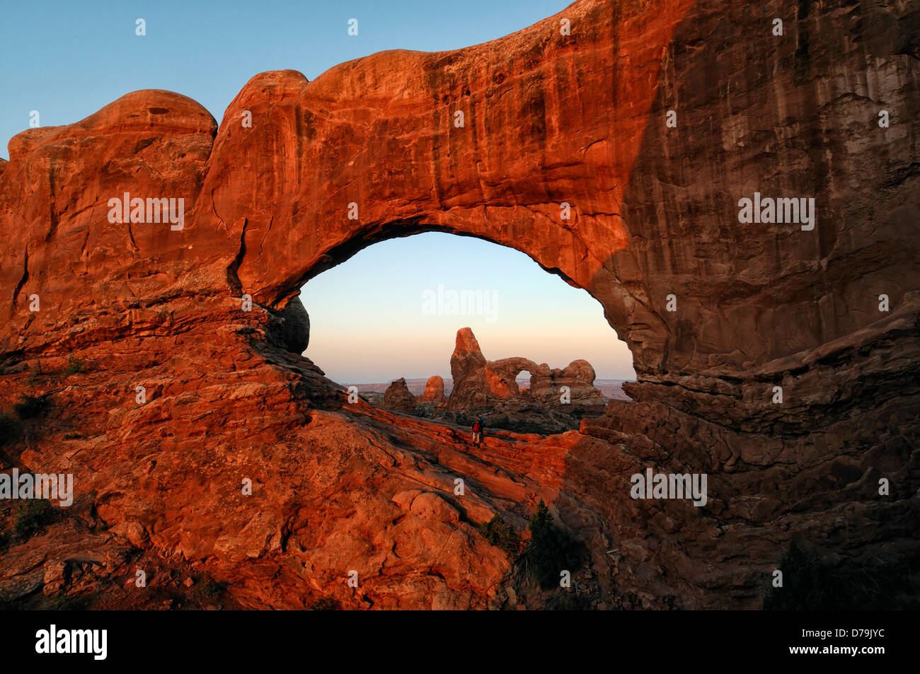 Turret Arch glow glowing red at sunrise viewed through North Window ...