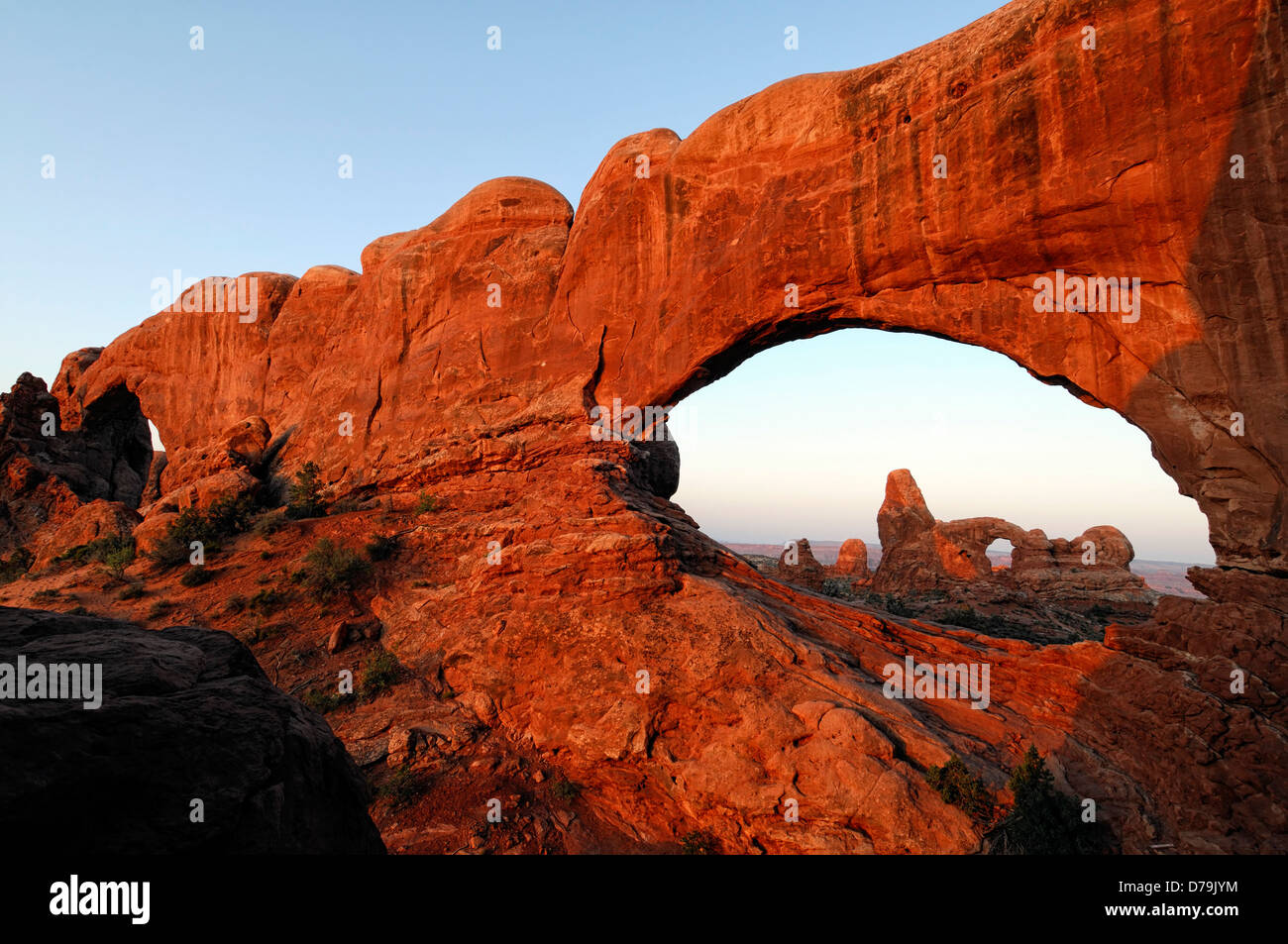Turret Arch glow glowing red at sunrise viewed through North Window ...