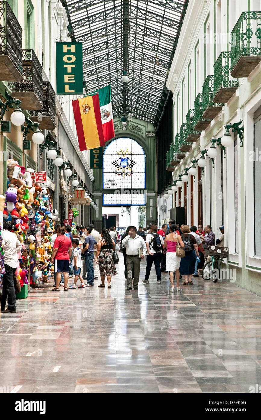 pedestrians in busy through block unique19th century cast iron shopping ...