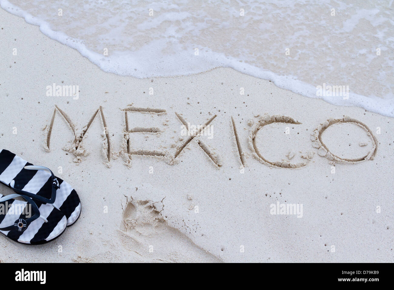 Mexico written on the beach with wave Stock Photo - Alamy