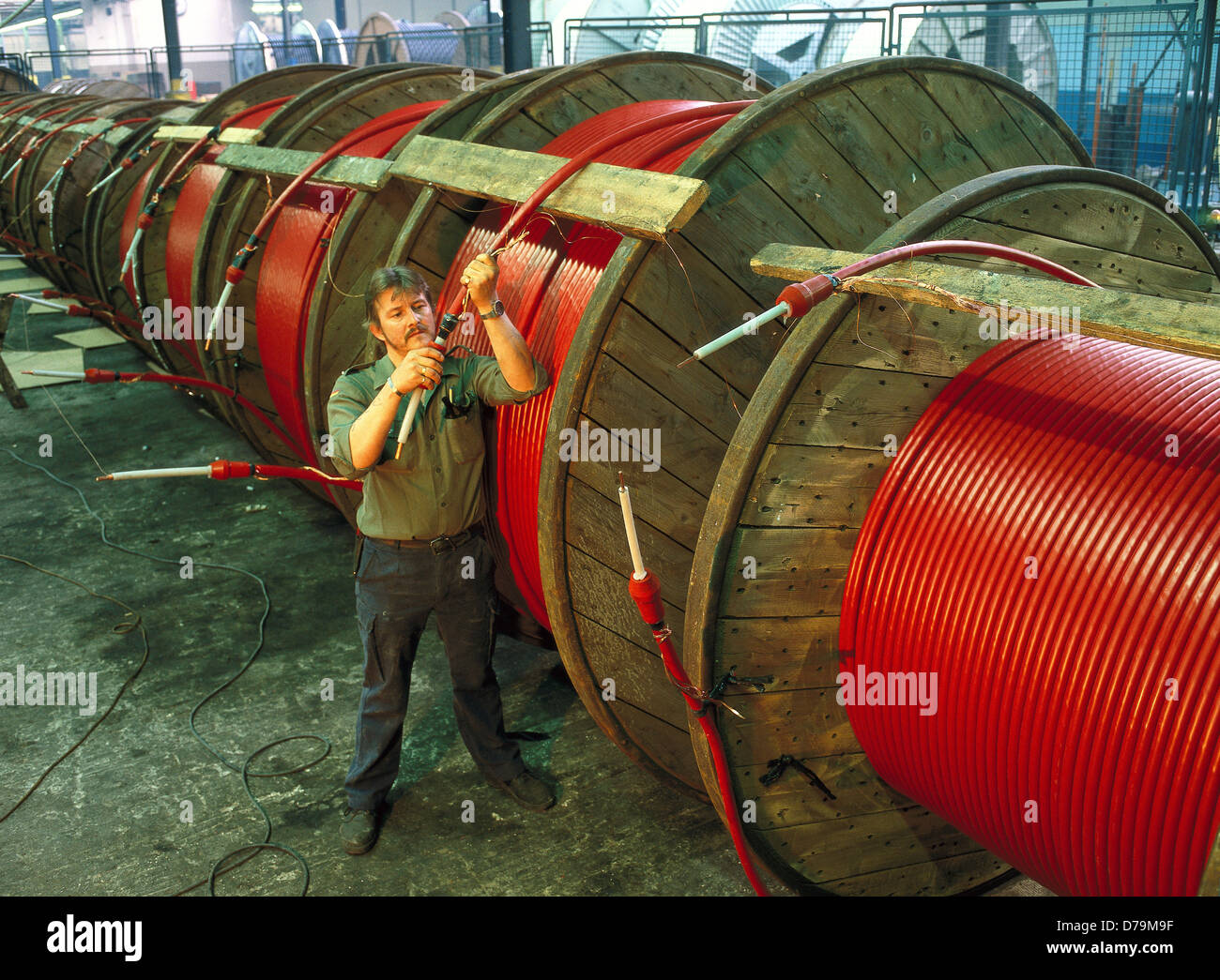Cables electric power supply on wooden spool Stock Photo - Alamy